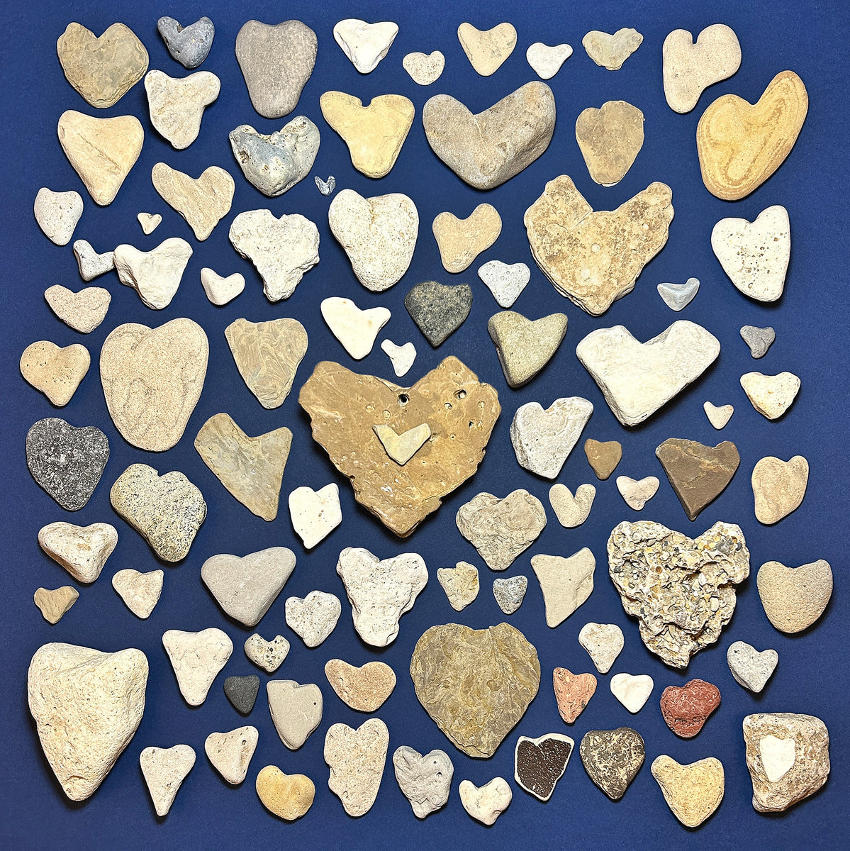 On The Beach | A Heap of Heart-Shaped Rocks